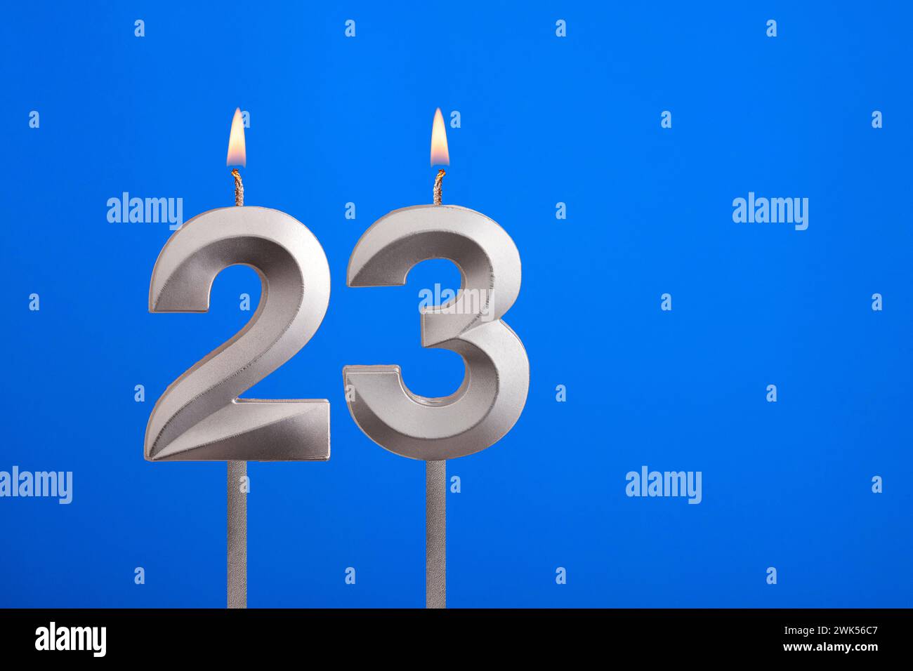 Birthday candle number 23 - Celebration card on blue background Stock ...
