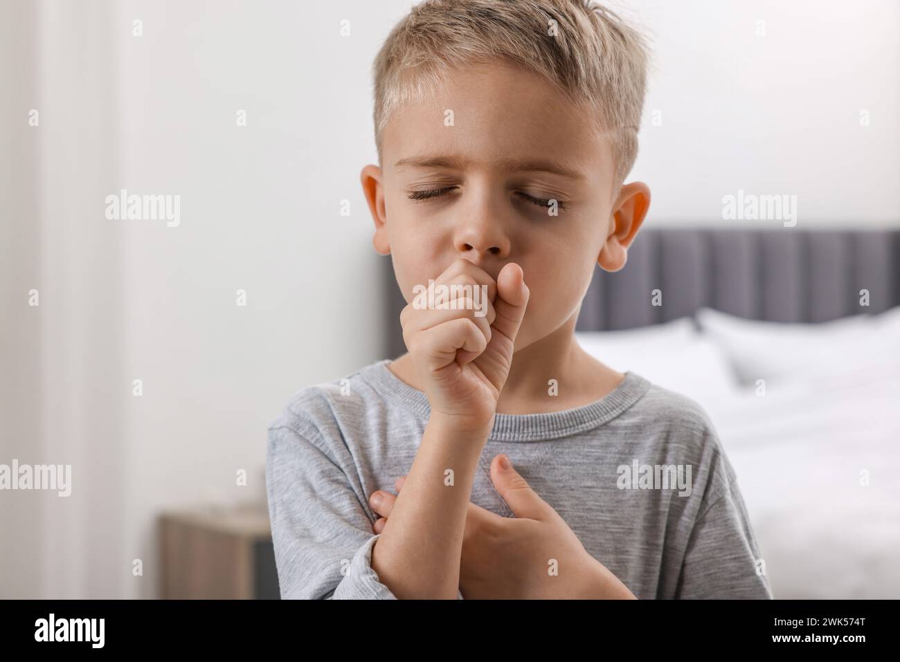 Sick boy coughing at home. Cold symptoms Stock Photo - Alamy