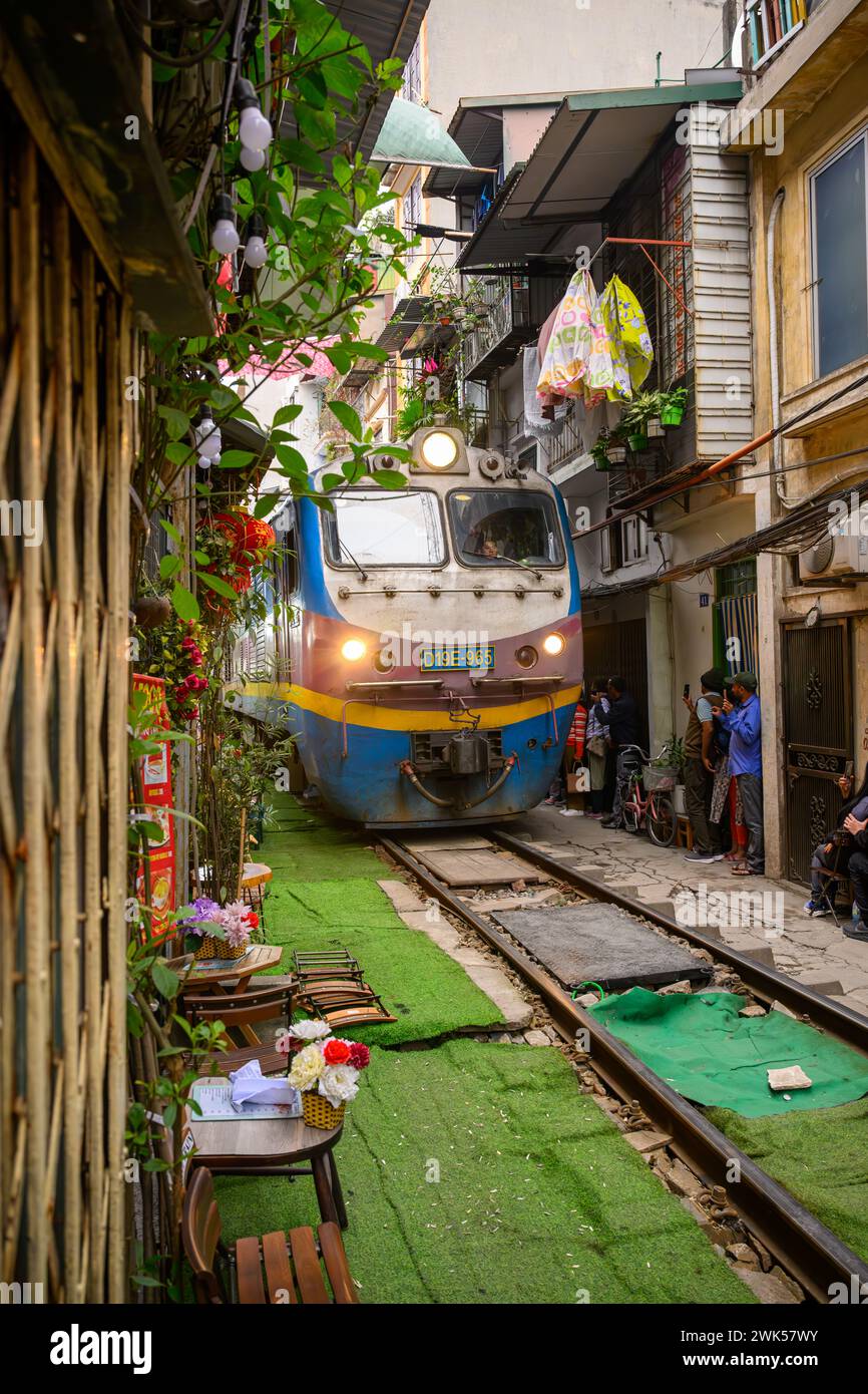 An approaching Vietnamese railway train on Train Street, Hanoi, Vietnam ...