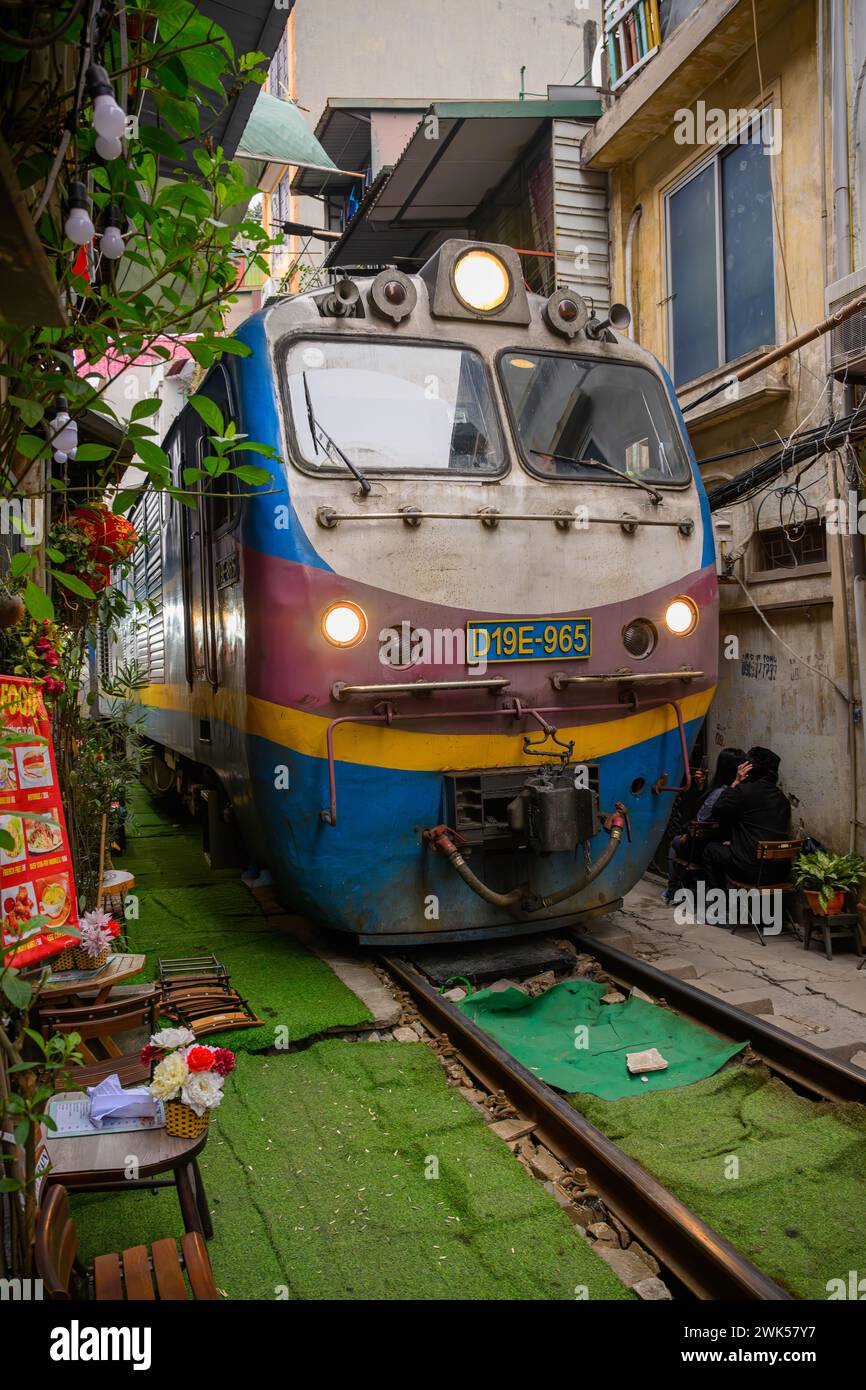 An approaching Vietnamese railway train on Train Street, Hanoi, Vietnam ...