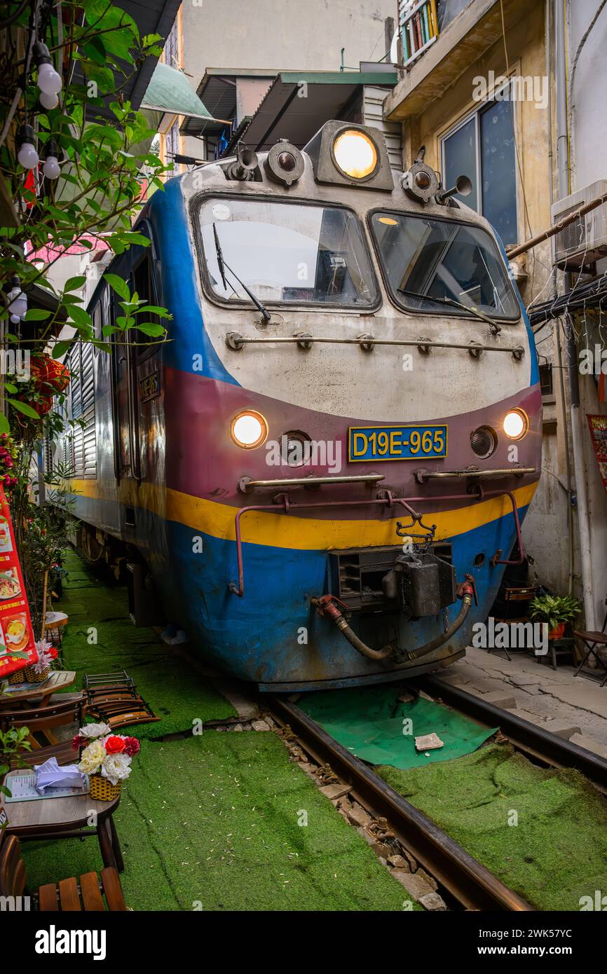 An approaching Vietnamese railway train on Train Street, Hanoi, Vietnam ...