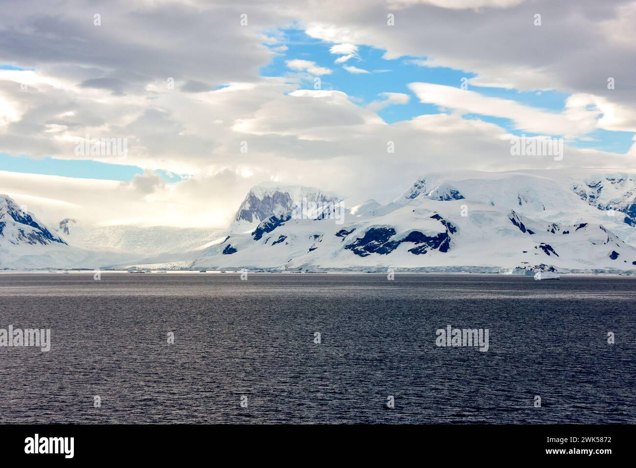 Mountains on land and icebergs floating in Antarctica Stock Photo - Alamy