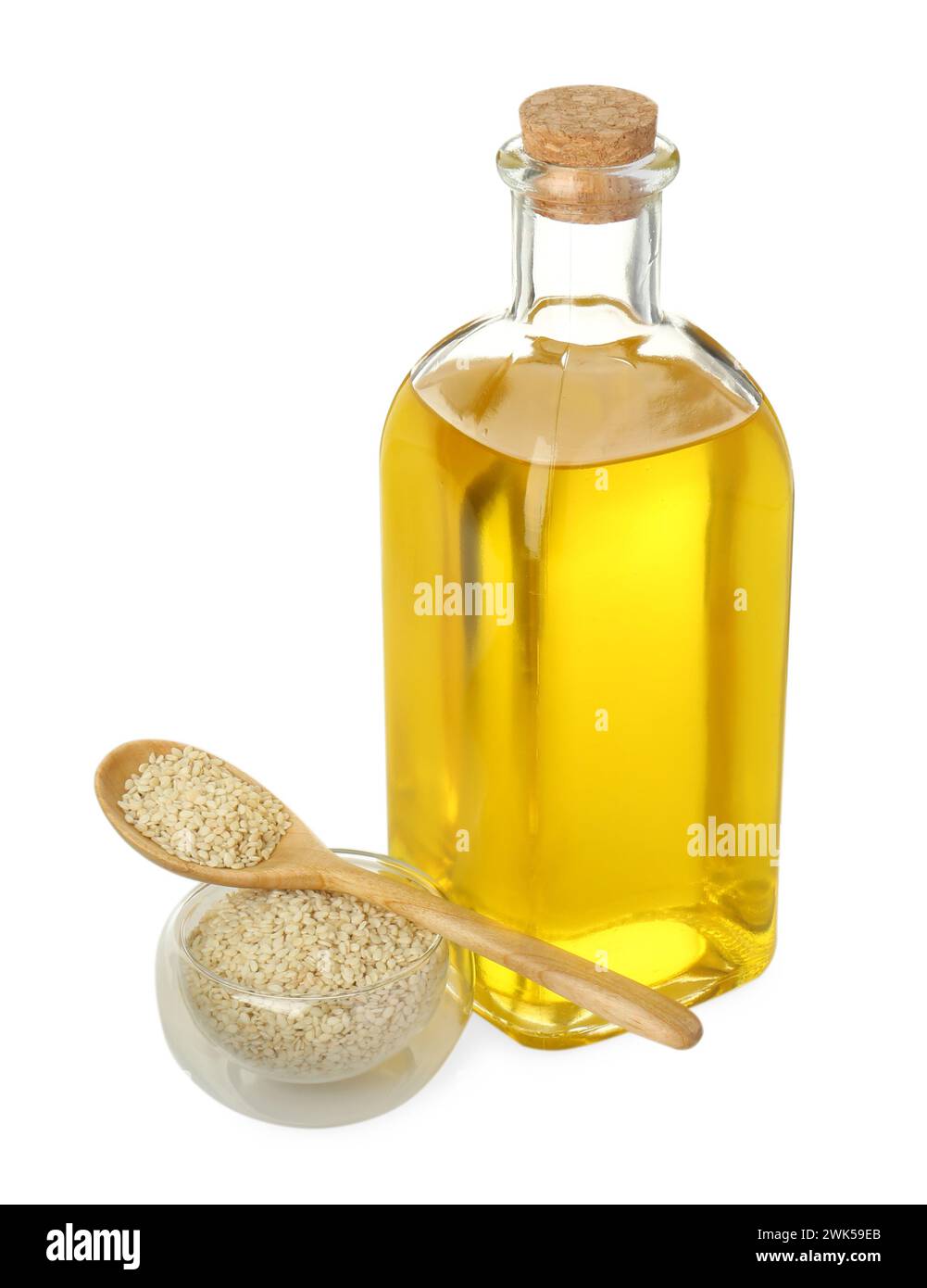 Vegetable fats. Sesame oil in glass bottle and seeds isolated on white ...