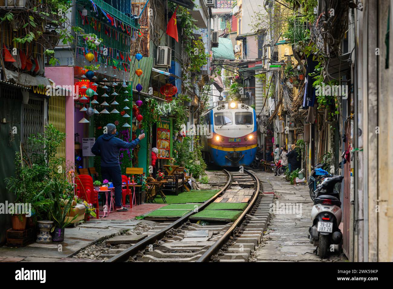 An approaching Vietnamese railway train on Train Street, Hanoi, Vietnam ...