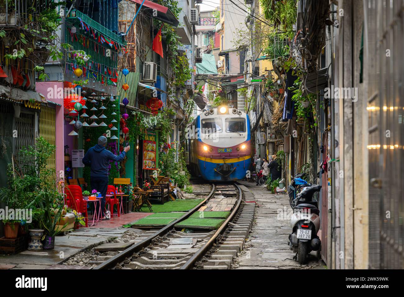 An approaching Vietnamese railway train on Train Street, Hanoi, Vietnam ...