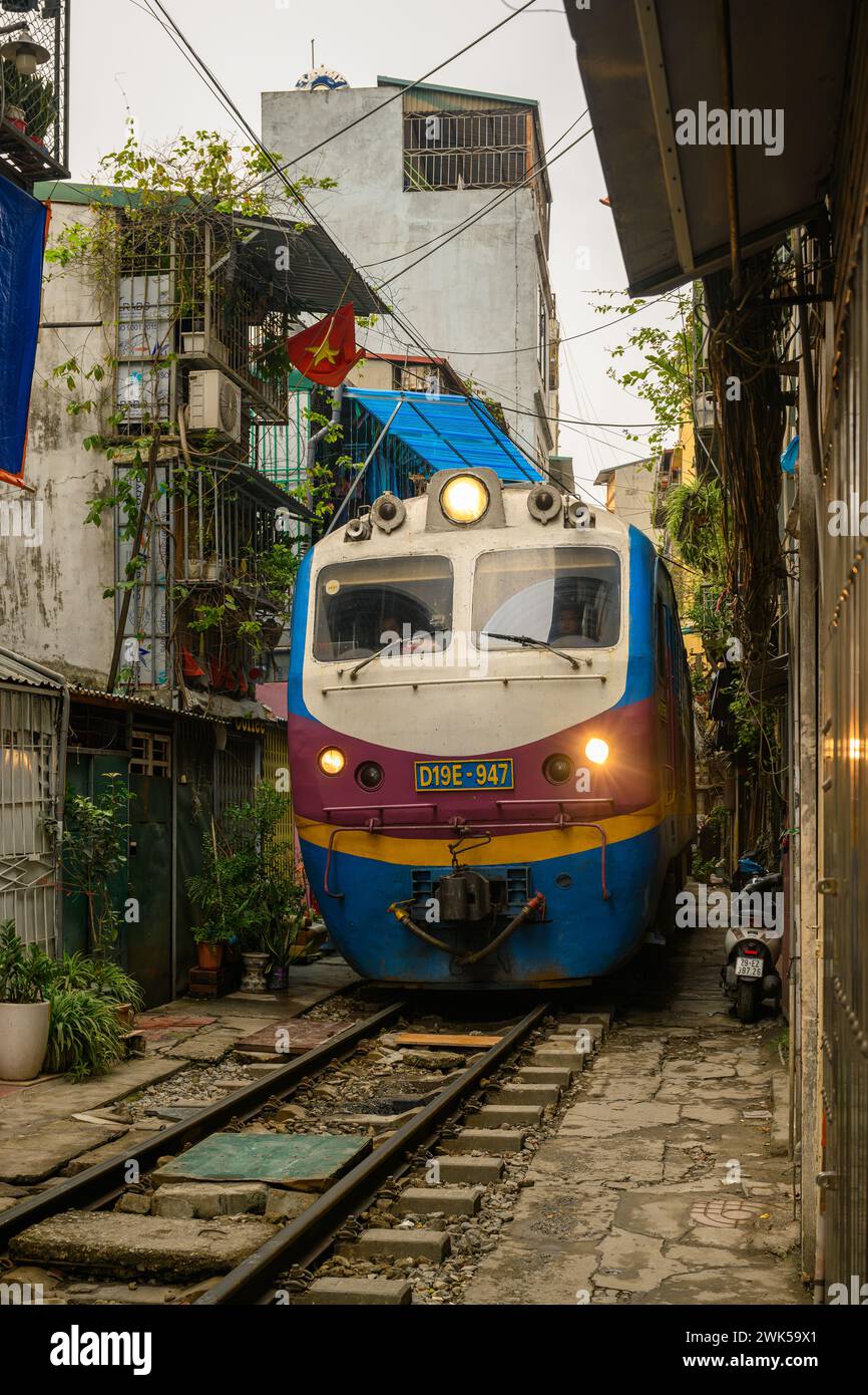 An approaching Vietnamese railway train on Train Street, Hanoi, Vietnam ...