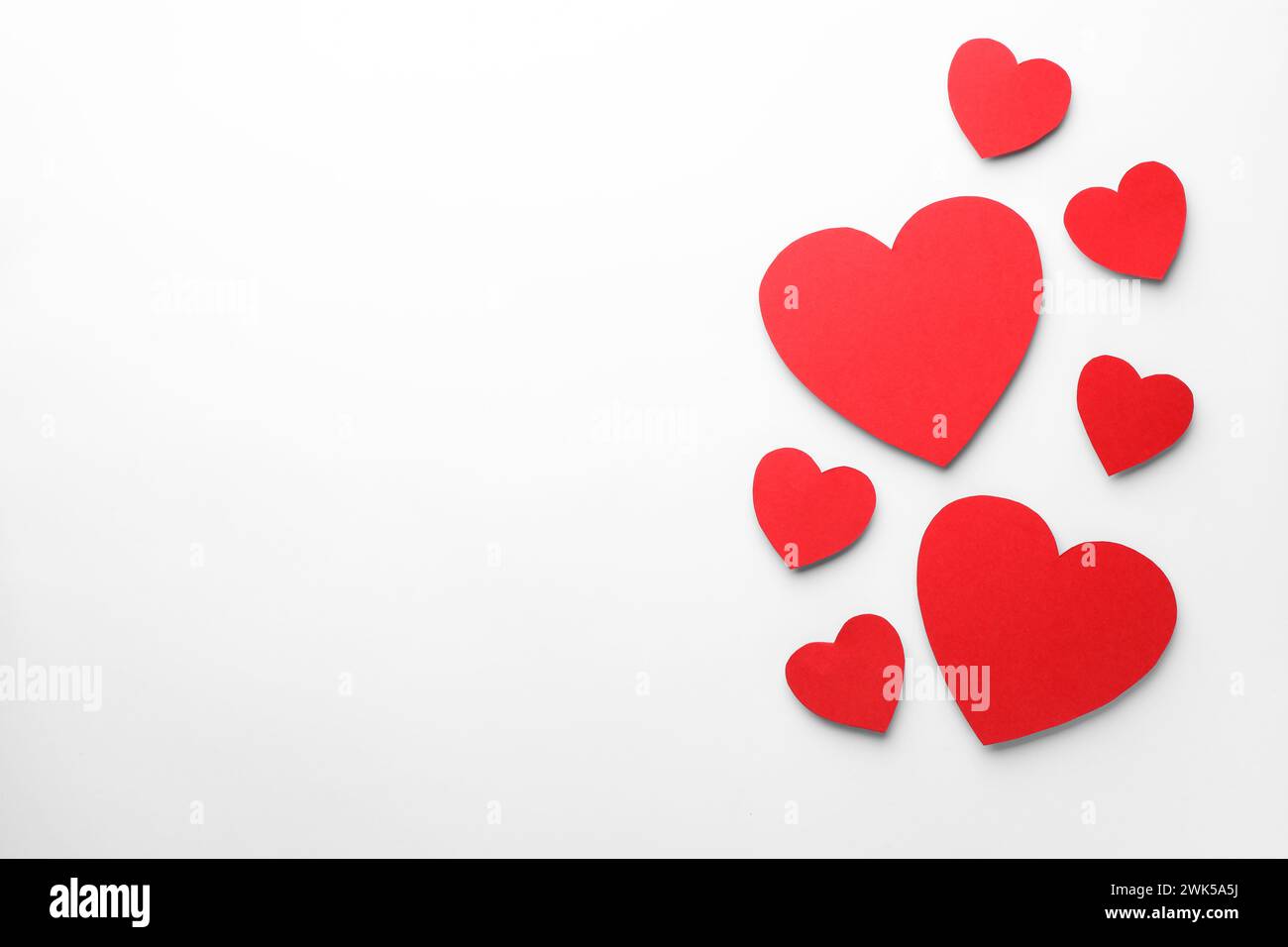 Paper hearts on white background, flat lay. Space for text Stock Photo ...