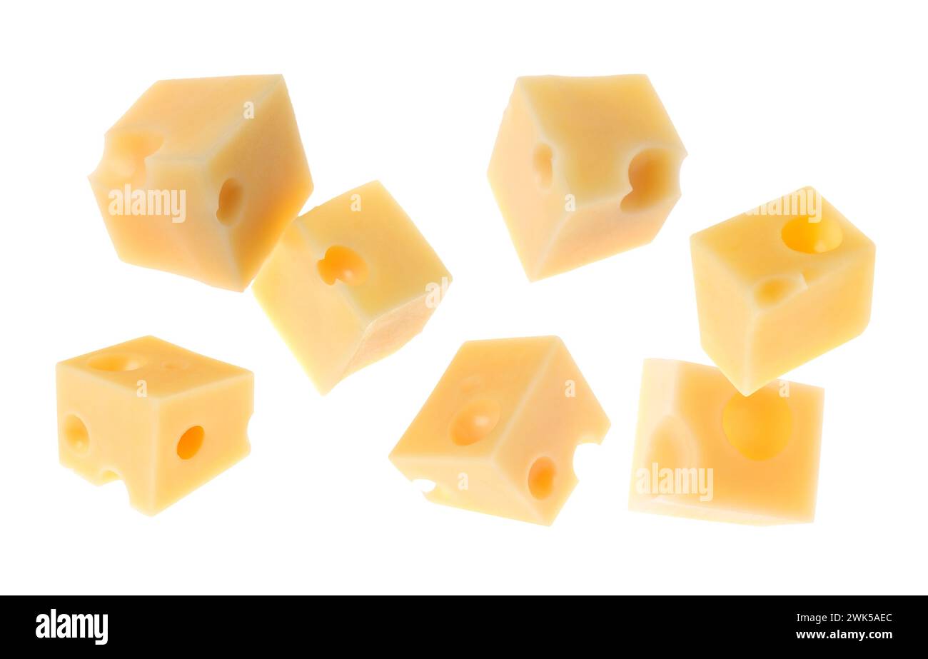 Pieces of cheese flying on white background Stock Photo - Alamy