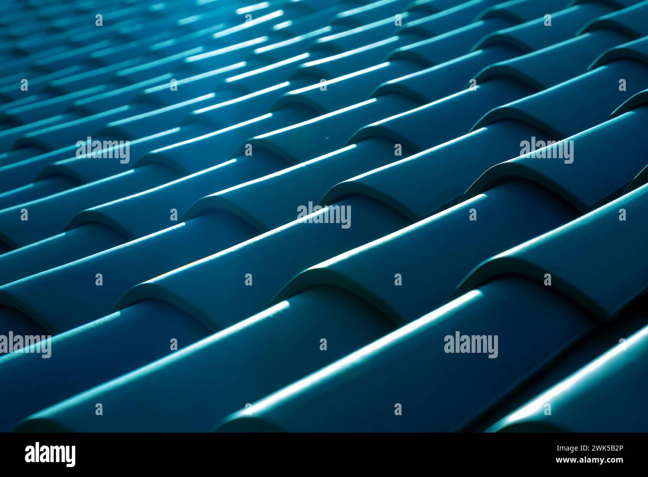 Blue colored classic corrugated roof tiles, shingles, close up texture ...