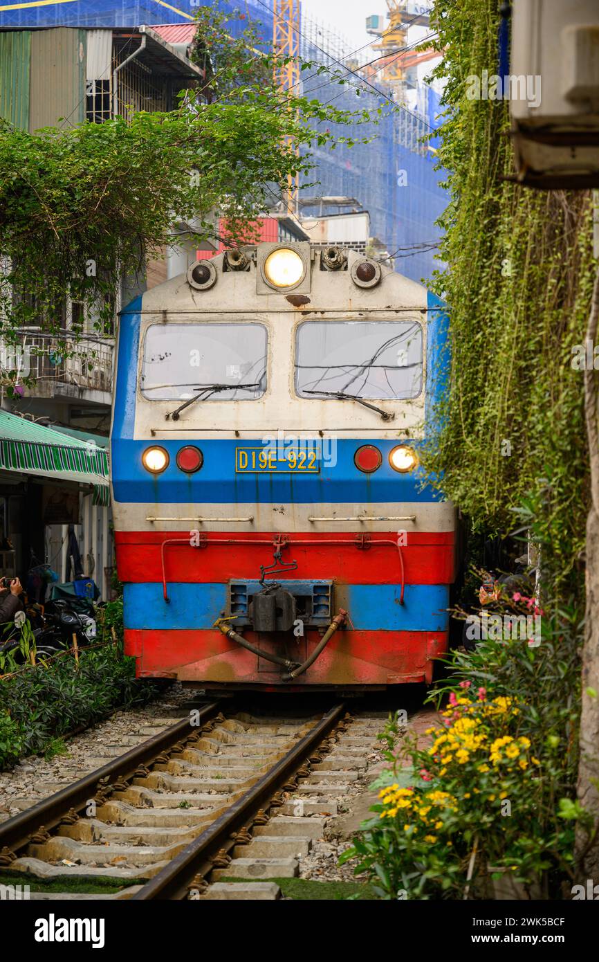 An approaching Vietnamese railway train on Train Street, Hanoi, Vietnam ...
