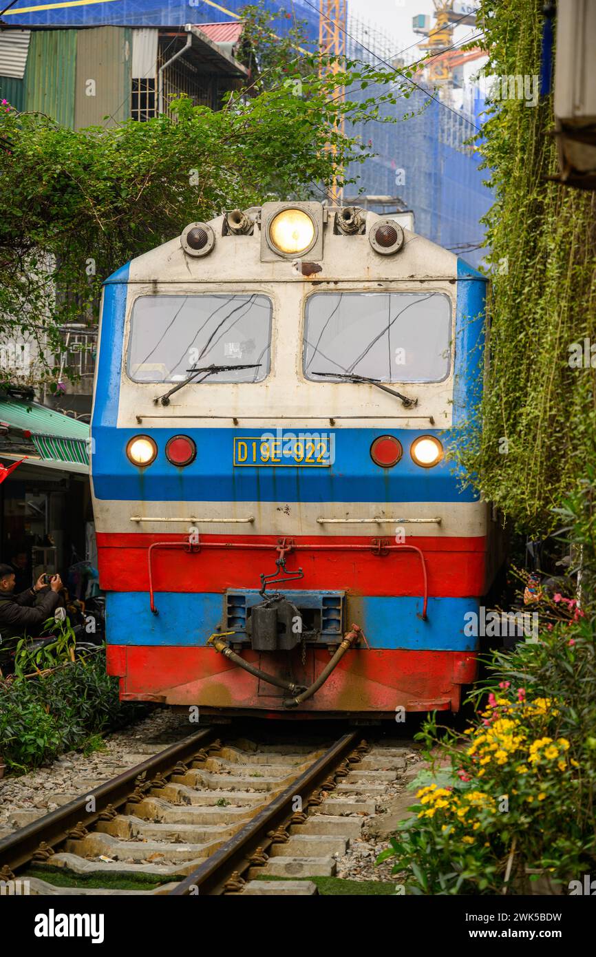 An approaching Vietnamese railway train on Train Street, Hanoi, Vietnam ...