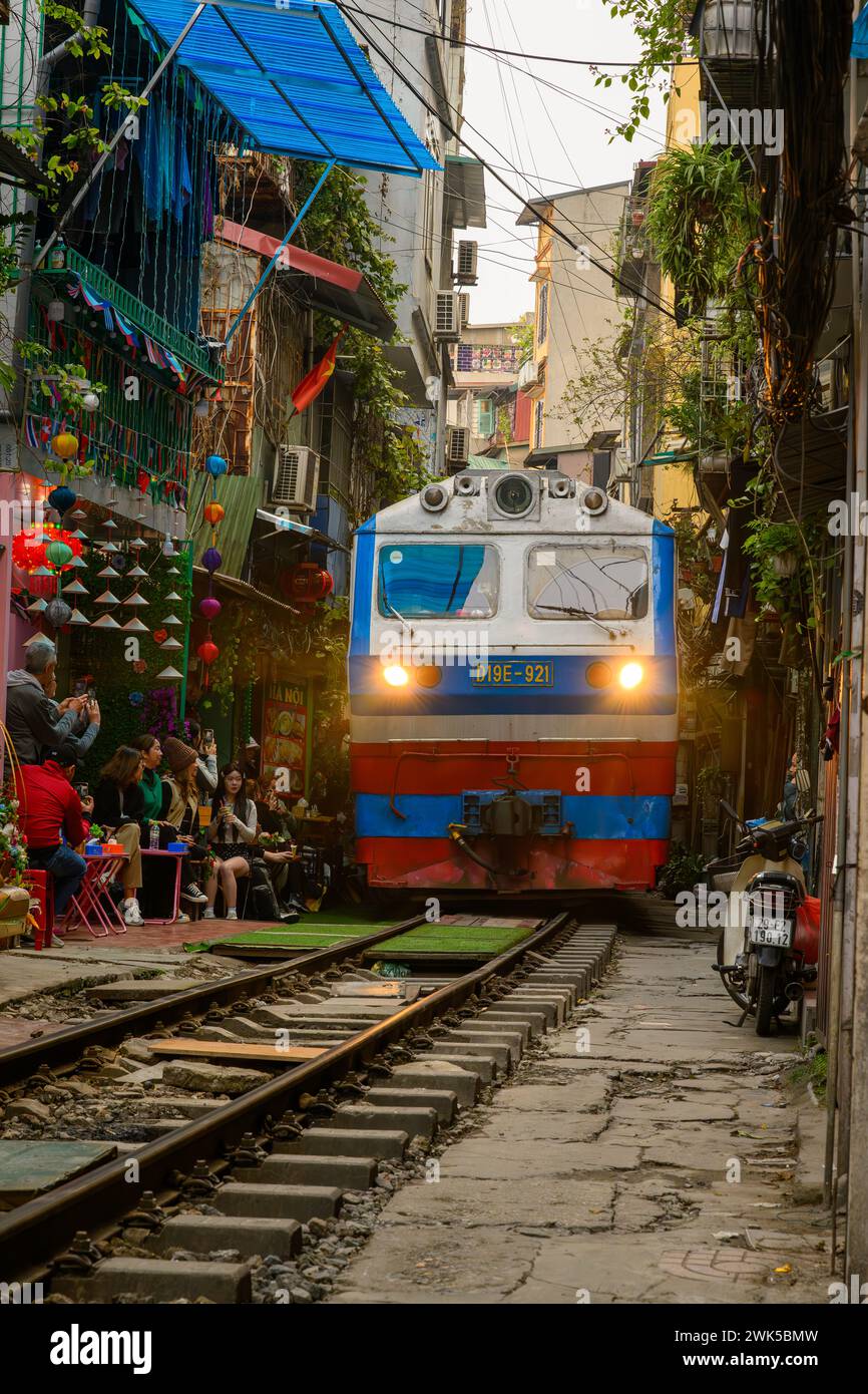 An approaching Vietnamese railway train on Train Street, Hanoi, Vietnam ...