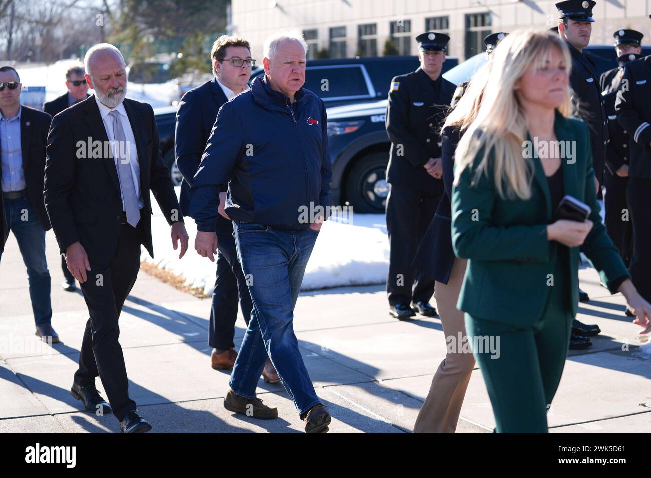 Minnesota Gov. Tim Walz, center, arrives at City Hall before a press ...