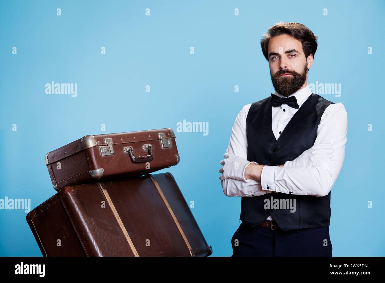 Hotel bellhop wearing gloves uniform hi-res stock photography and ...