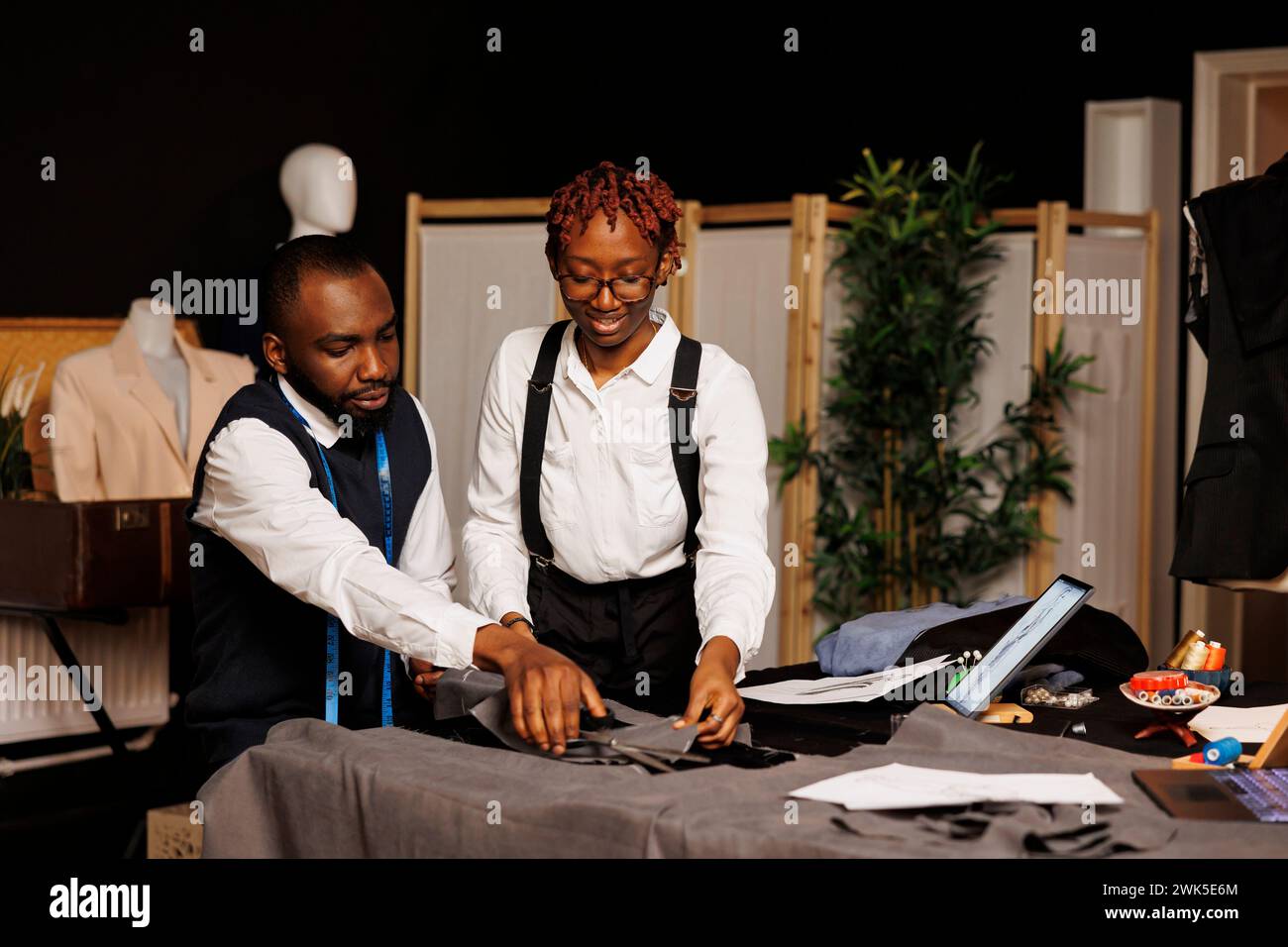 Precise suitmaking process in tailoring studio by african american ...