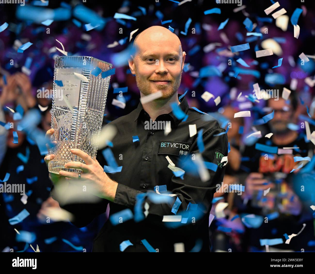 Gary Wilson lifts the Ray Reardon Trophy as he celebrates his victory ...
