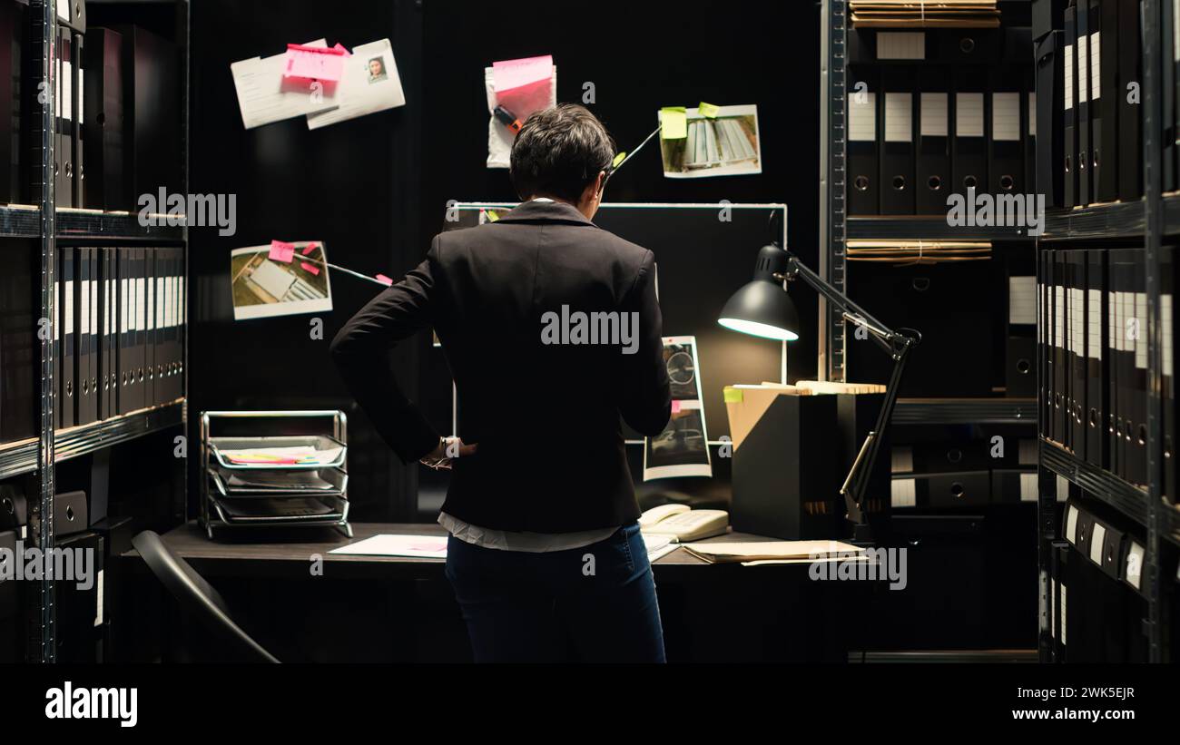 Private inspector analyzing case files, gathering intelligence to solve ...