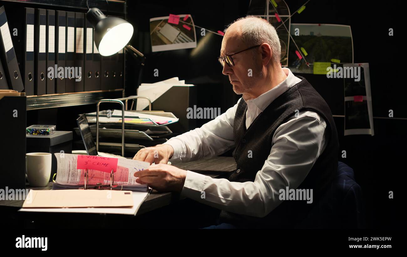 Law officer examine police documents to uncover crucial case evidence ...