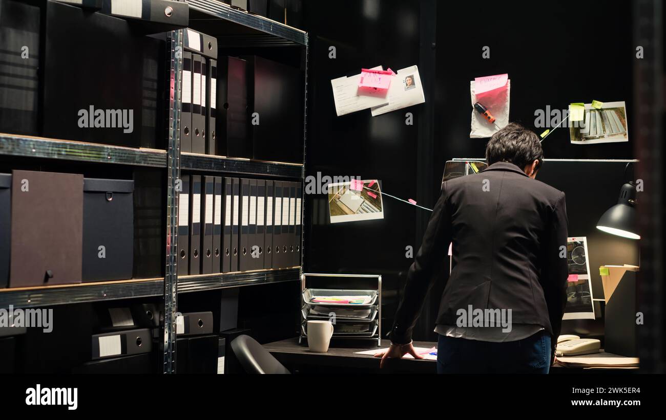 Private investigator working on police crime case, evaluating ...