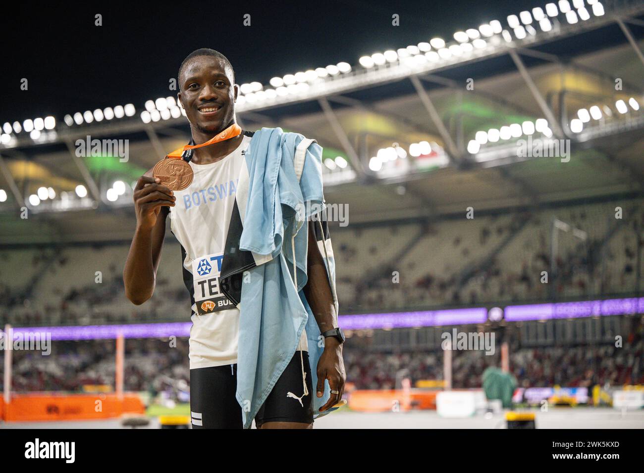 Letsile TEBOGO celebrating his medal with the flag in the Budapest 2023 ...