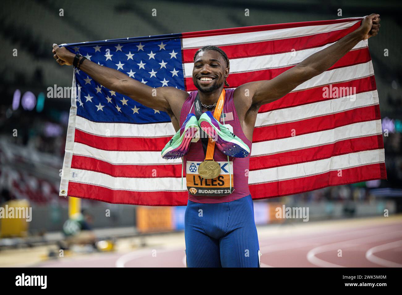 Noah LYLES celebrating his medal with the flag in the Budapest 2023 ...