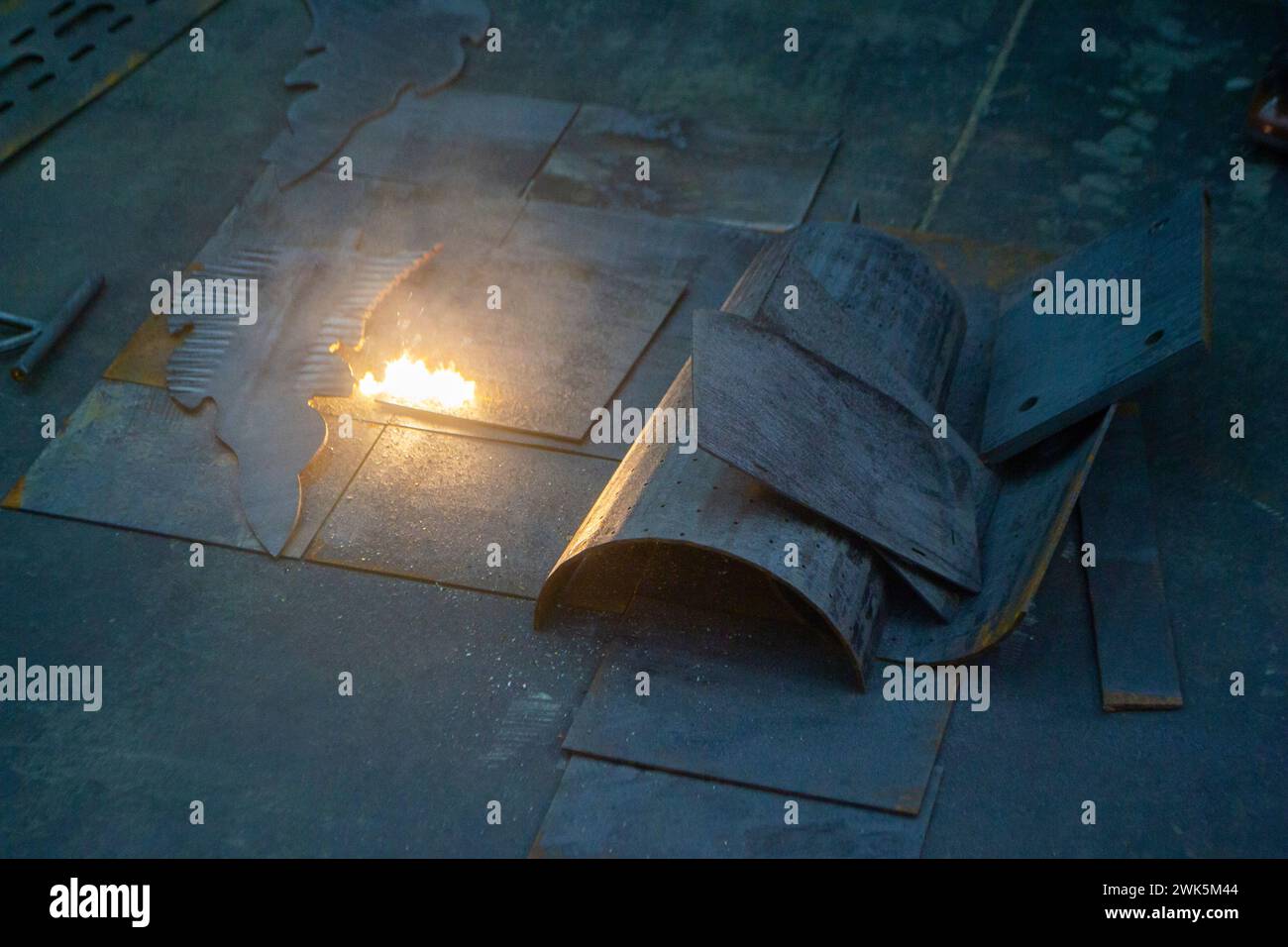 Laser cleaning of metal. The laser beam cleans the metal surface from ...