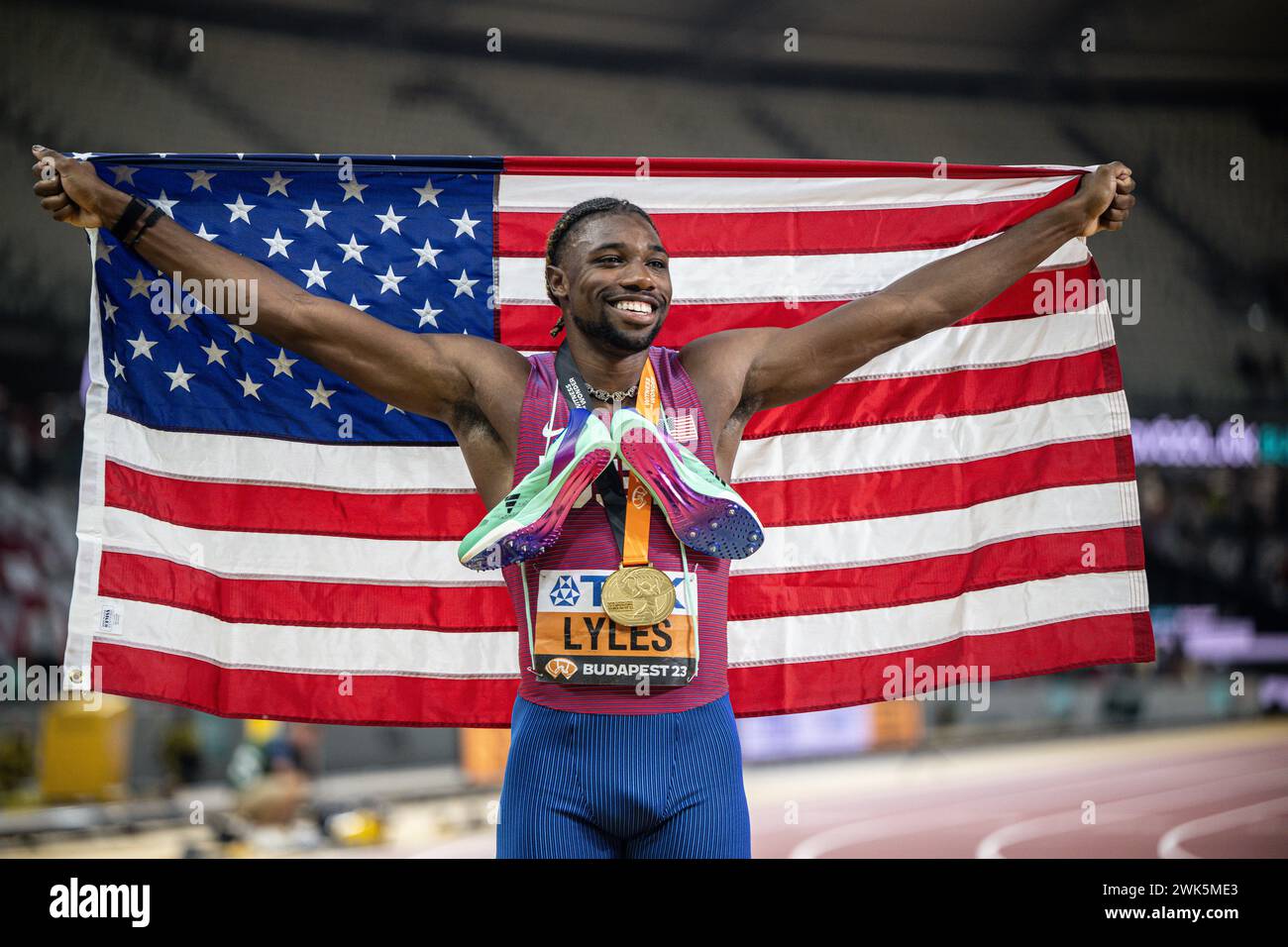 Noah LYLES celebrating his medal with the flag in the Budapest 2023 ...