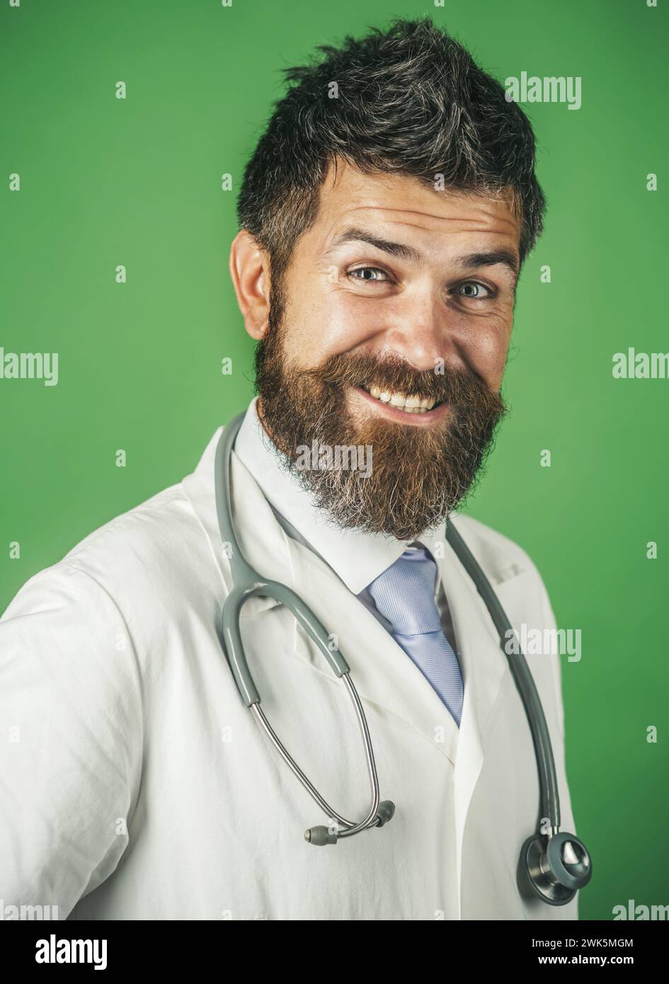 Happy male doctor in white medical coat with stethoscope. Treatment ...