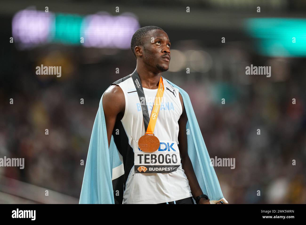 Letsile TEBOGO celebrating his medal with the flag in the Budapest 2023 ...