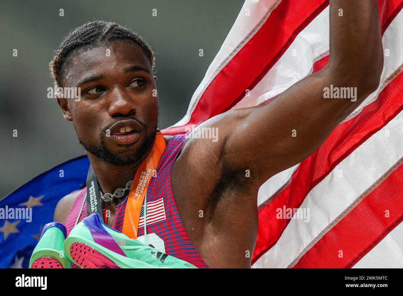 Noah LYLES celebrating his medal with the flag in the Budapest 2023 ...