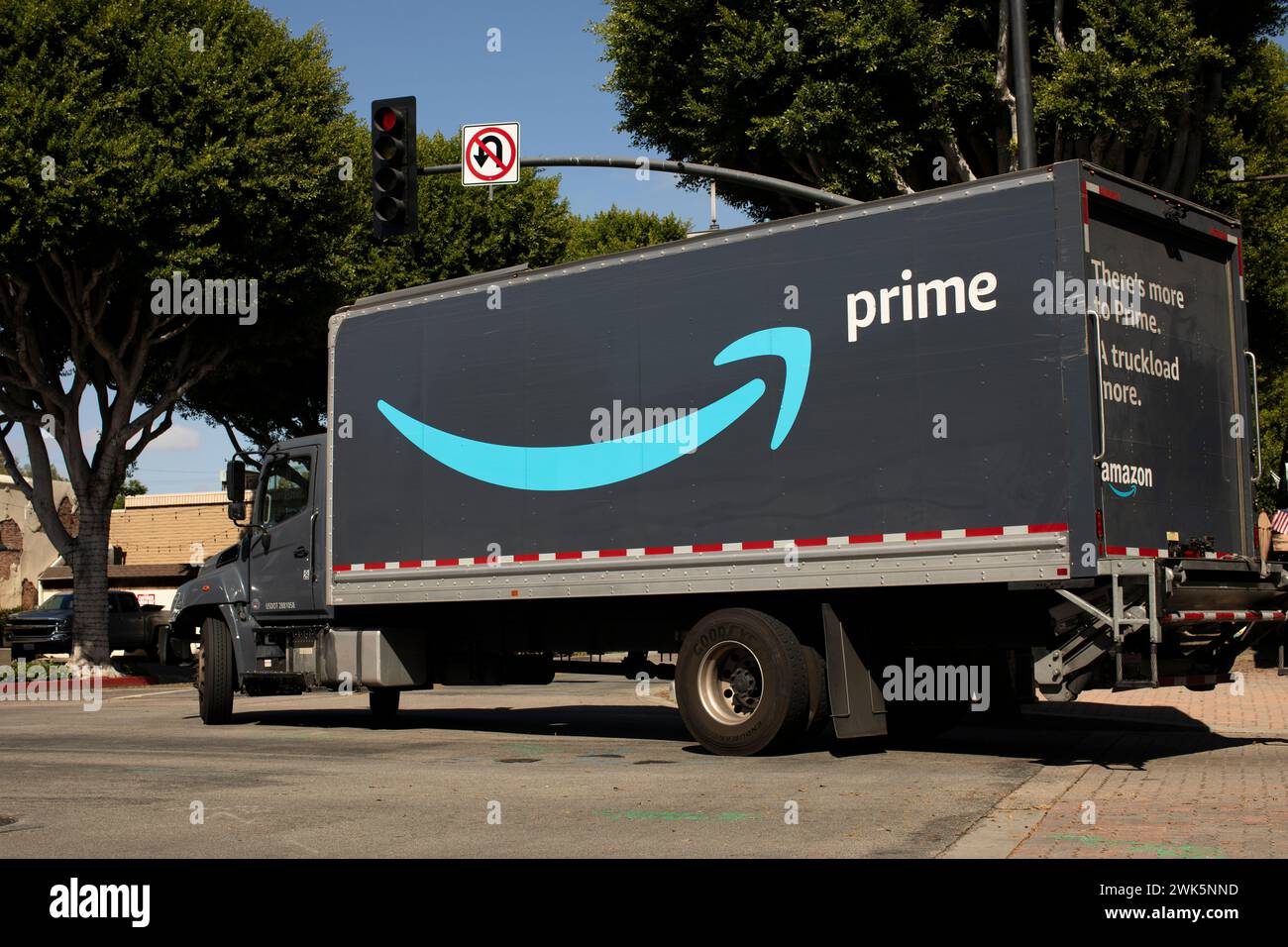 Tustin, California, USA - October 22, 2023: Afternoon sun shines on an Amazon Prime semi truck ...