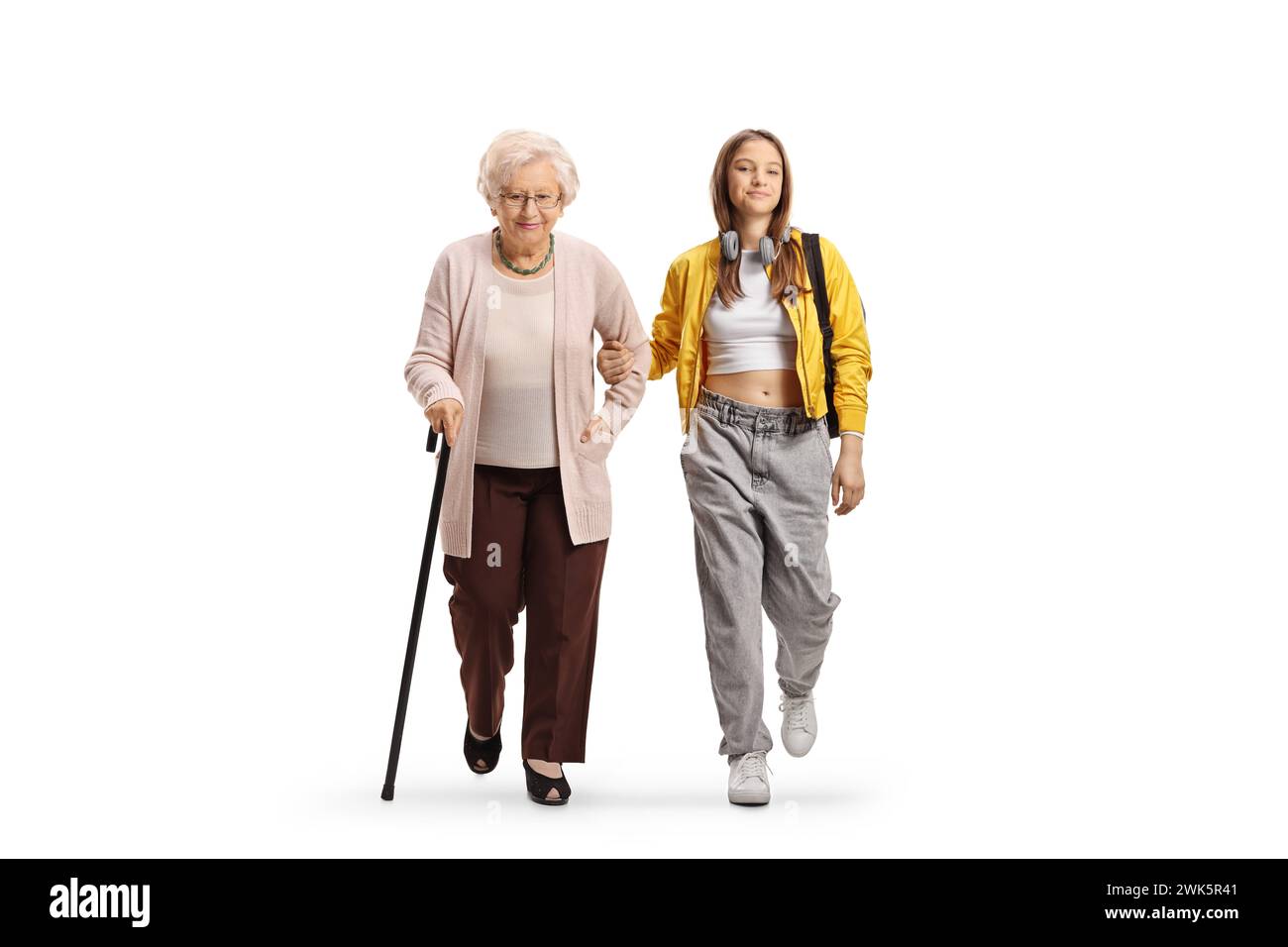 Granddaughter walking with grandmother hand under hand isolated on ...