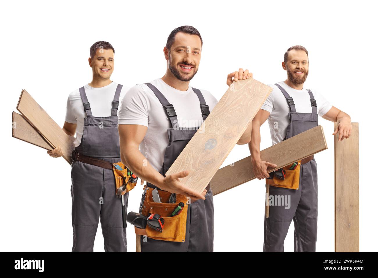 Team of carpenters holding wooden floor beams isolated on white ...