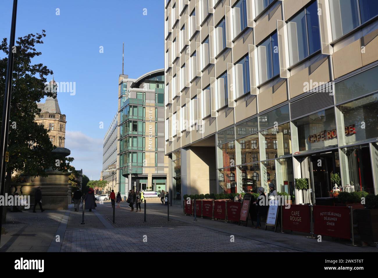Streetscene in Sheffield city centre England UK, Mercure hotel and cafe ...