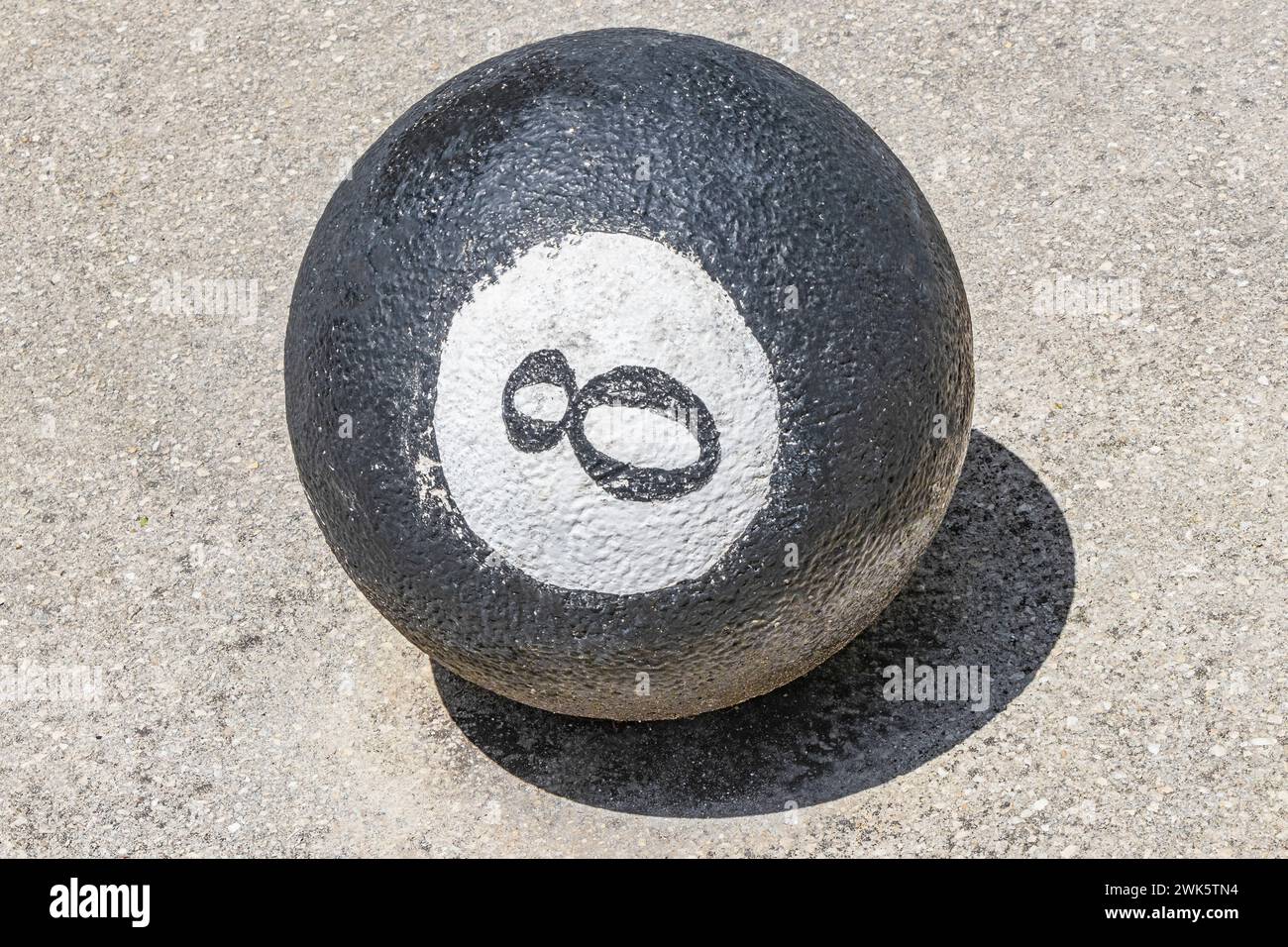Decorative stone rock cement balls with graffiti painting on sidewalks ...