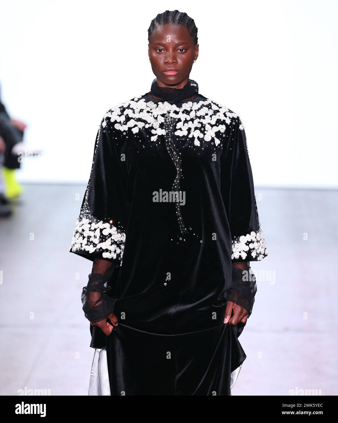 London, UK. 18th Feb, 2024. A model walks the runway during the SUNCUN ...