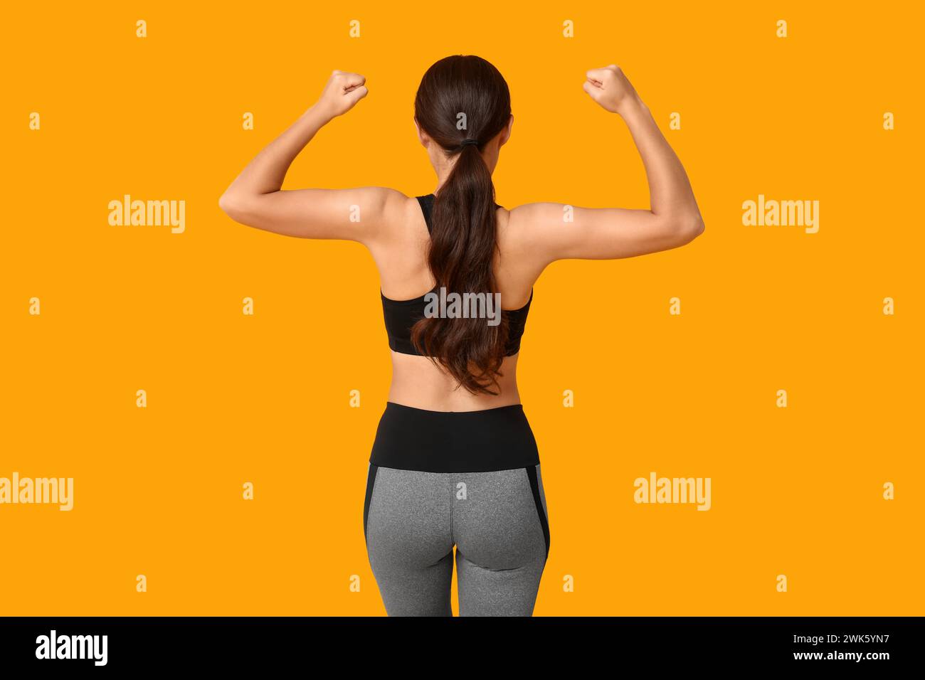 Back view woman showing muscles hi-res stock photography and images - Alamy