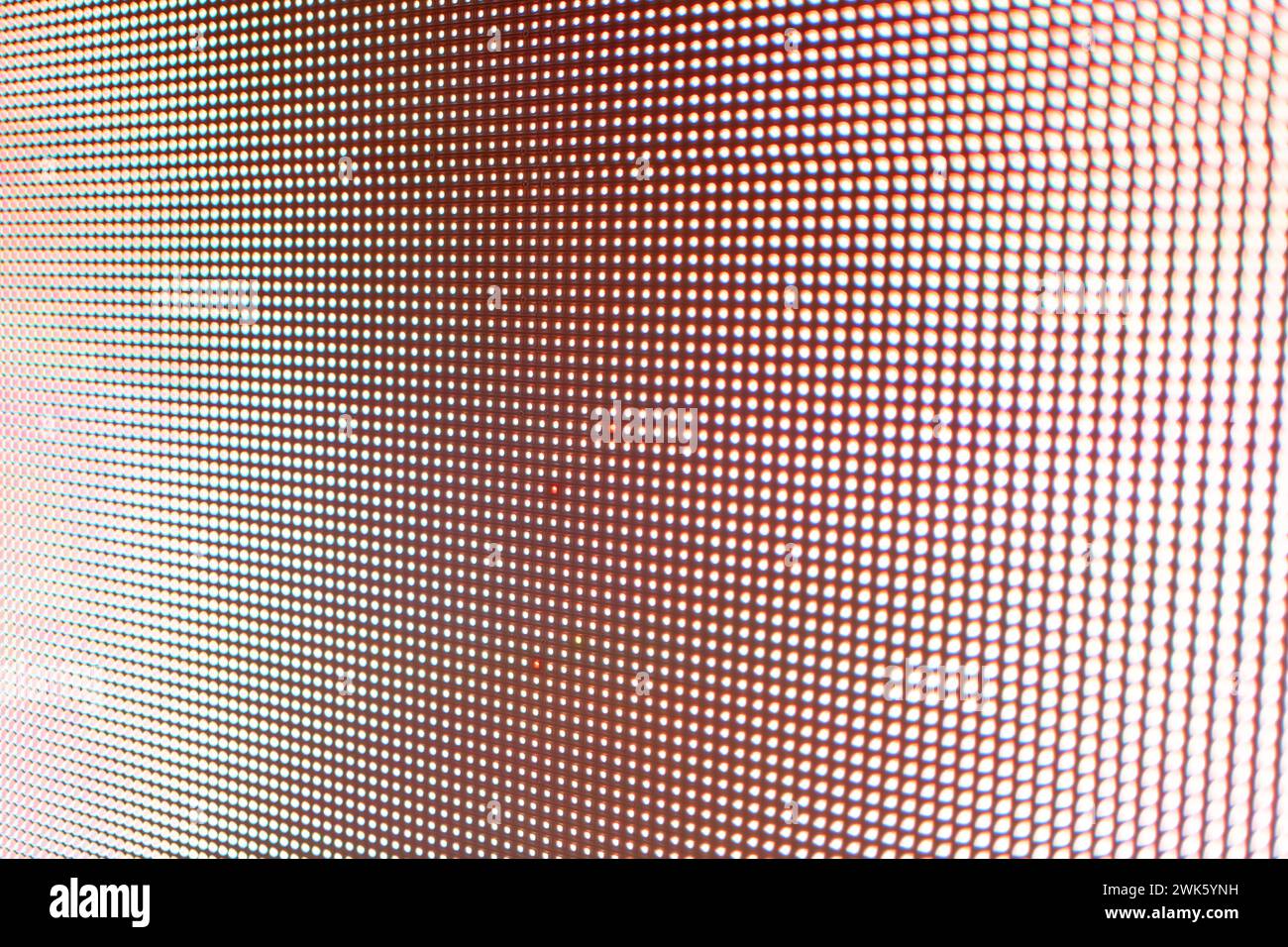 Abstract light gradient texture displayed on an LED screen with red ...