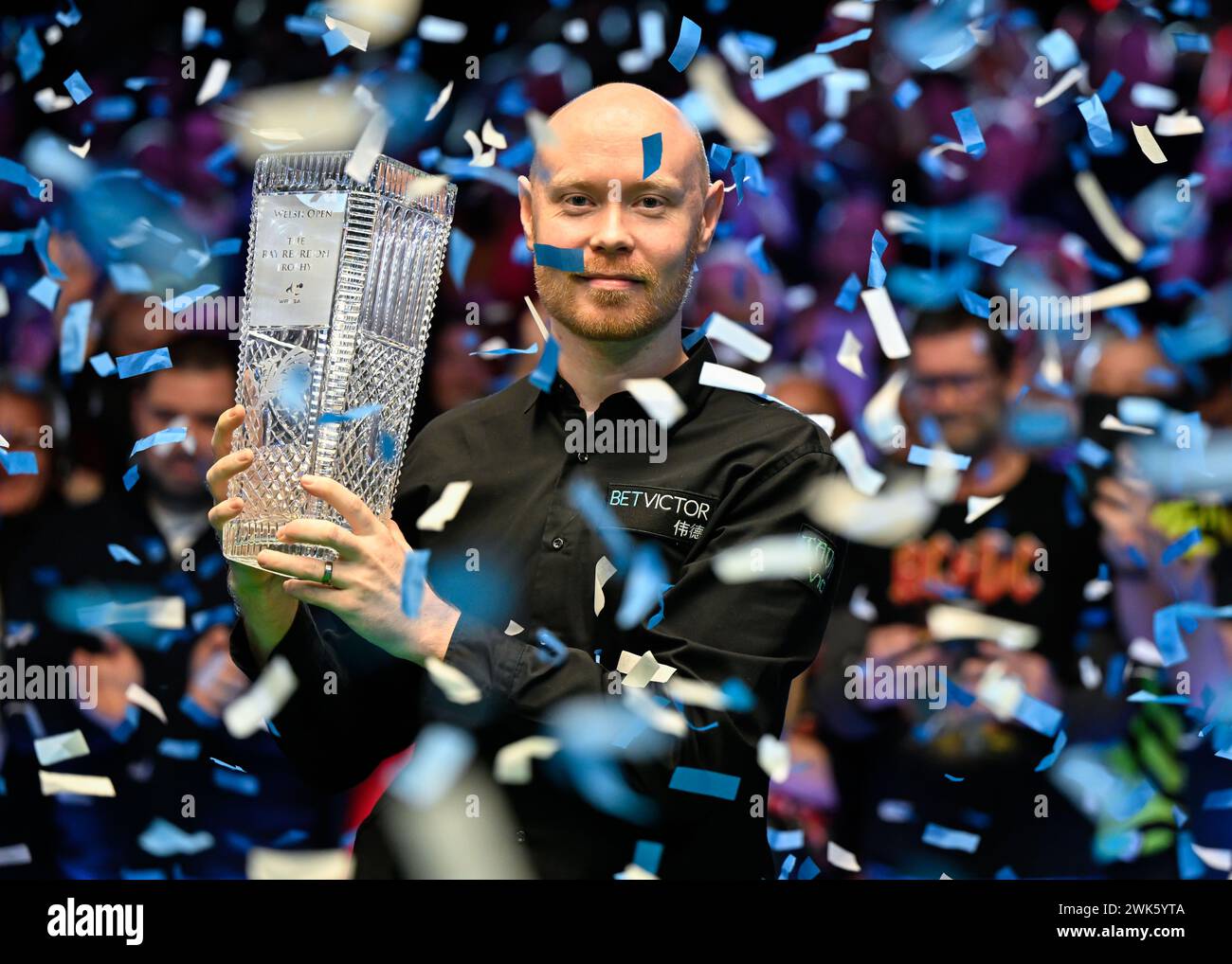 Gary Wilson lifts the Ray Reardon Trophy as he celebrates his victory ...