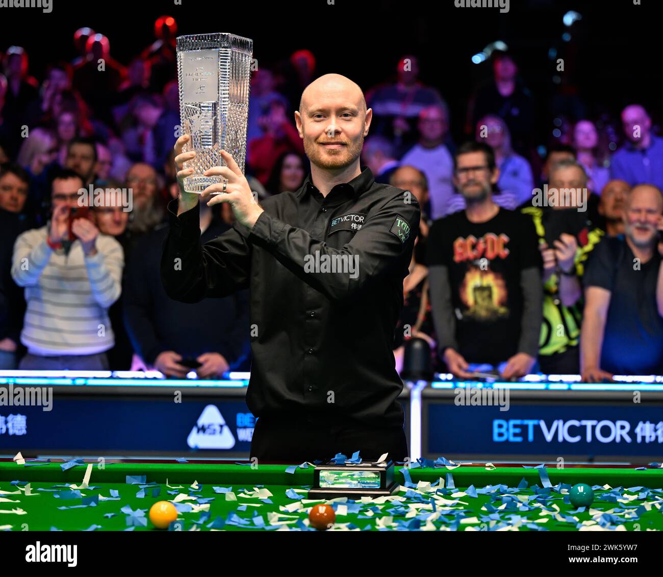 Gary Wilson lifts the Ray Reardon Trophy as he celebrates his victory ...