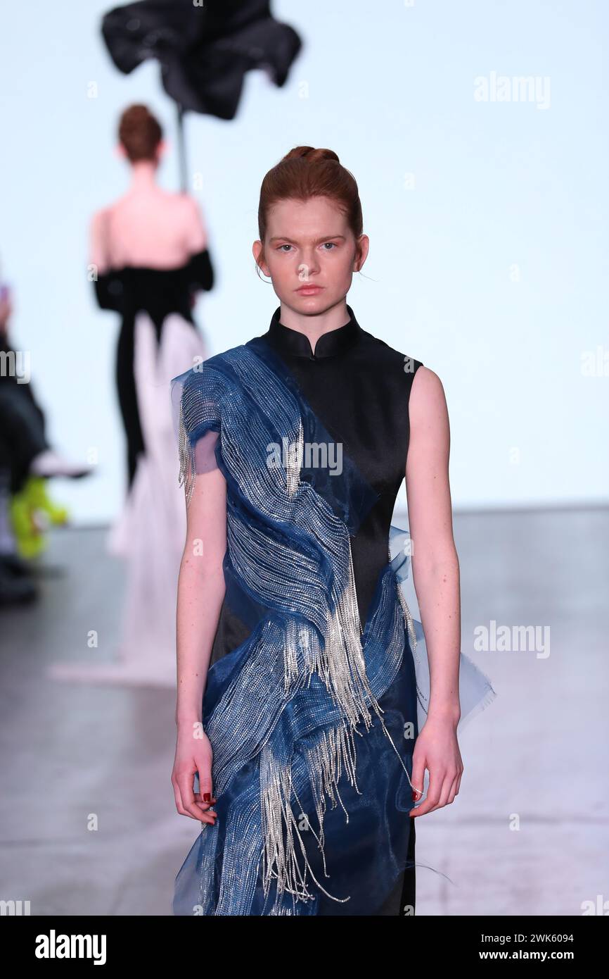 London, UK. 18th Feb, 2024. A model walks the runway during the SUNCUN ...
