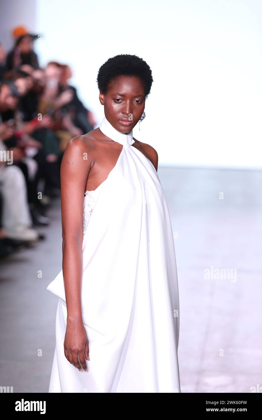 London, UK. 18th Feb, 2024. A model walks the runway during the SUNCUN ...