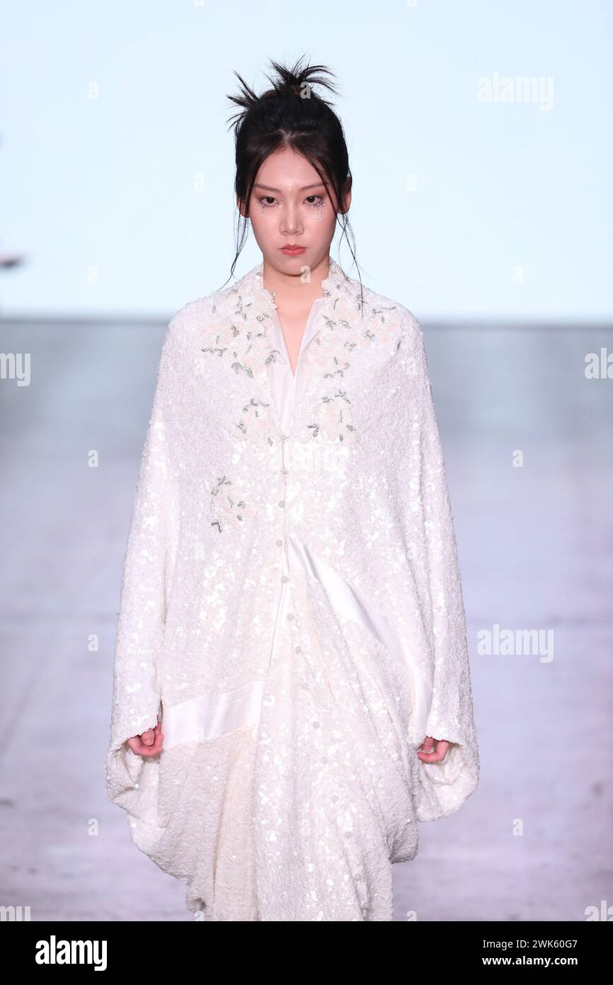 London, UK. 18th Feb, 2024. A model walks the runway during the SUNCUN ...