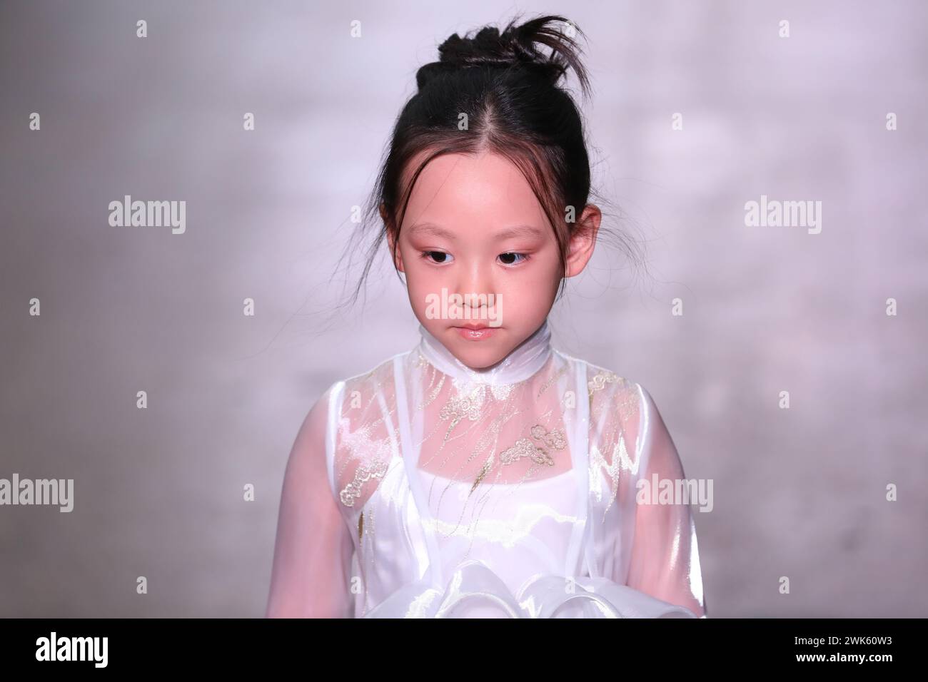 London, UK. 18th Feb, 2024. A model walks the runway during the SUNCUN ...
