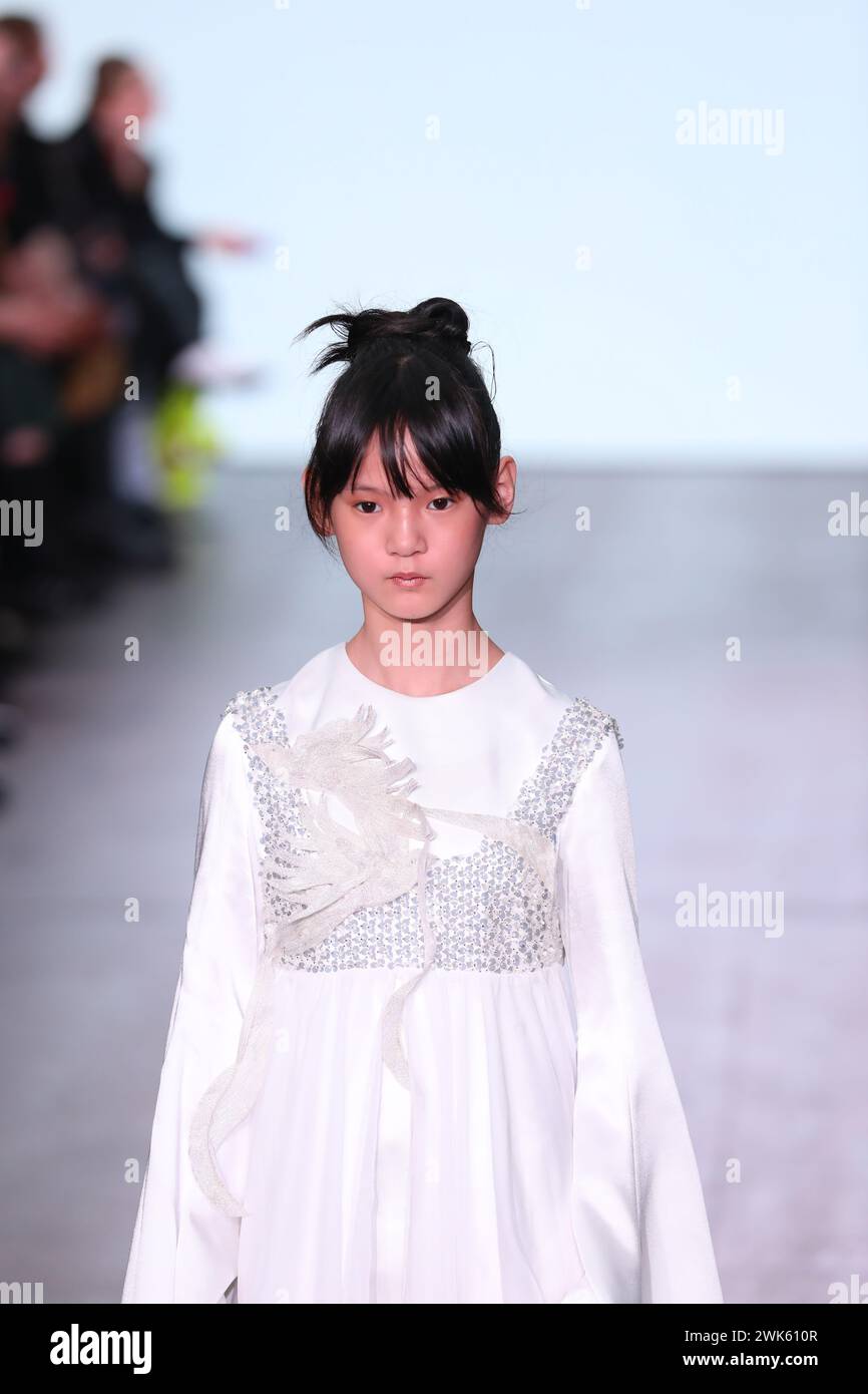 London, UK. 18th Feb, 2024. A model walks the runway during the SUNCUN ...