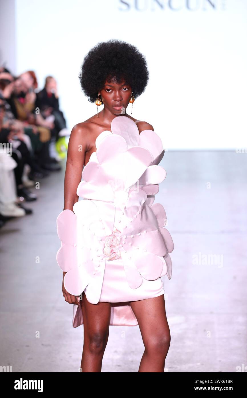 London, UK. 18th Feb, 2024. A model walks the runway during the SUNCUN ...