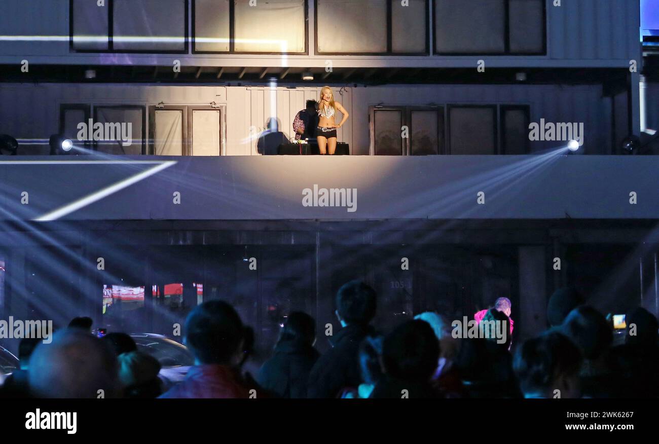 SHANGHAI, CHINA - FEBRUARY 12, 2024 - Visitors dance with a 3D light ...