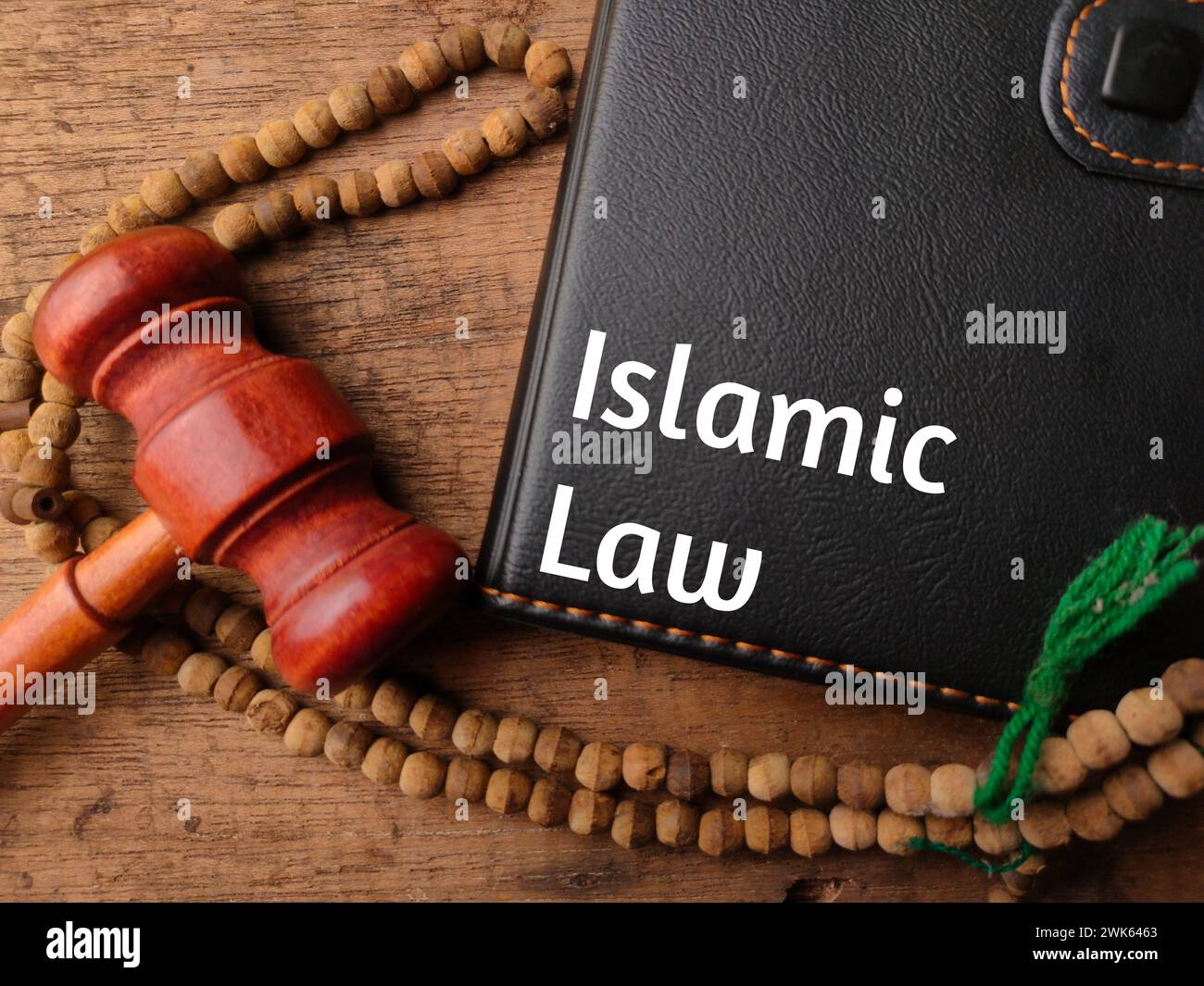 Top view prayer bead,gavel and notebook with text Islamic law on wooden ...