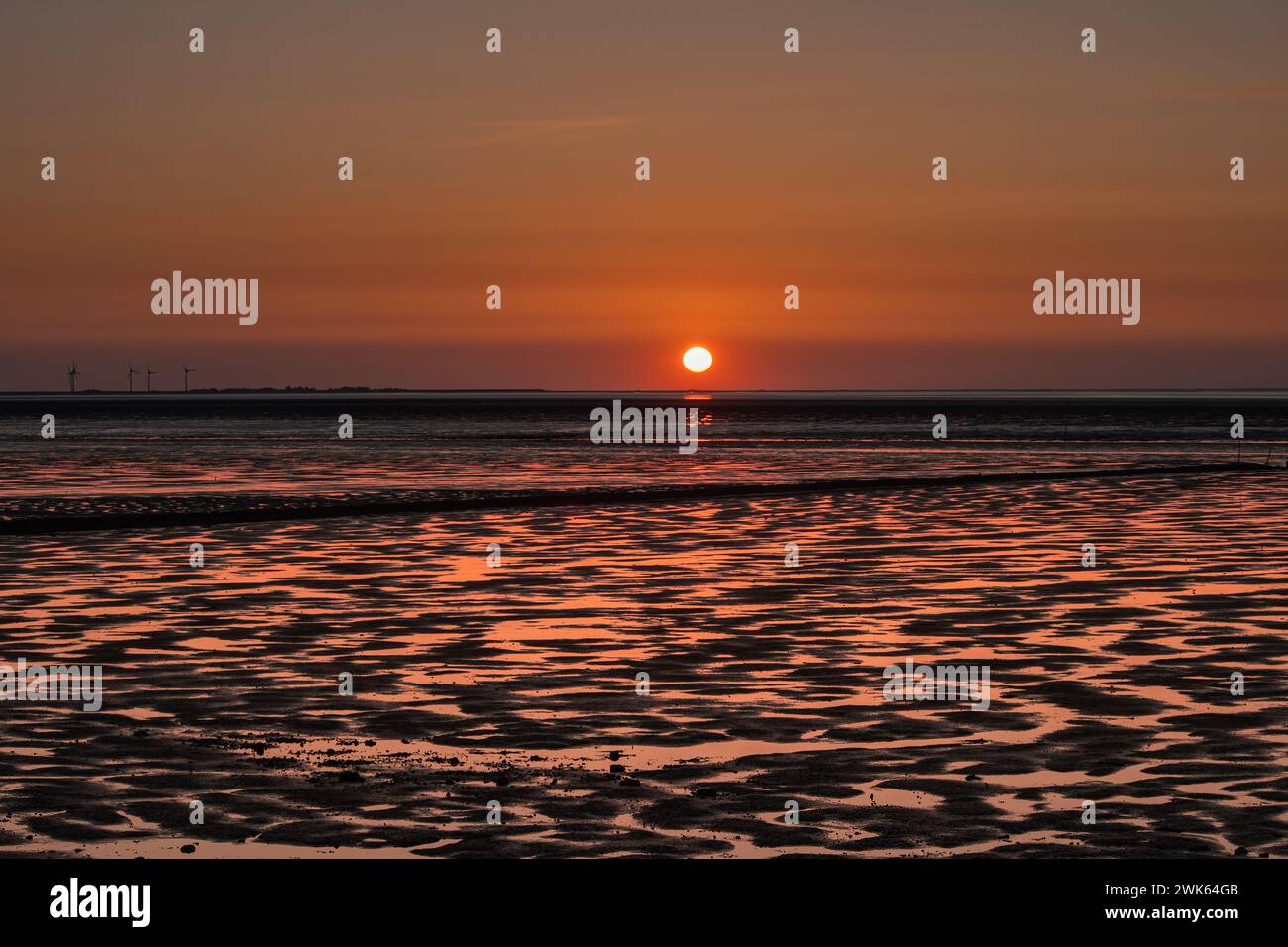 Sunset at low tide on the Nordstrand peninsula with a view of the ...