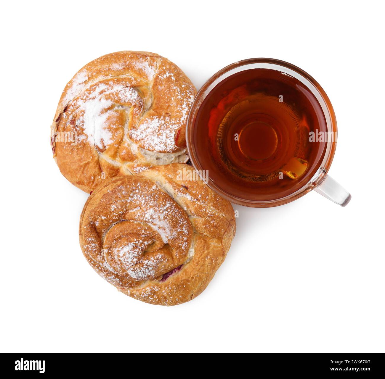 Delicious rolls with jam, powdered sugar and cup of tea isolated on ...